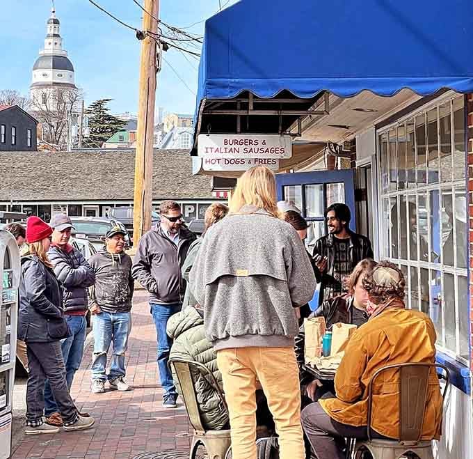 When a crowd gathers like this, you know something special is happening behind that blue and white awning.