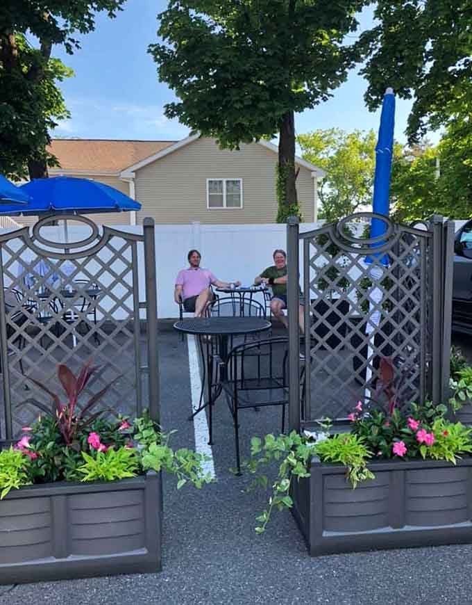Outdoor seating surrounded by flowers proves even diners can have a garden party vibe going on.