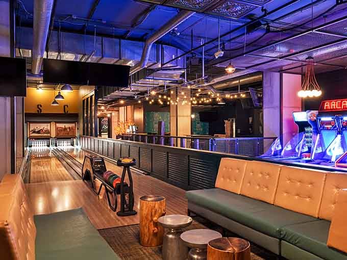 Bowling lanes gleam under modern lighting, waiting to witness your triumph or your spectacular gutter ball.