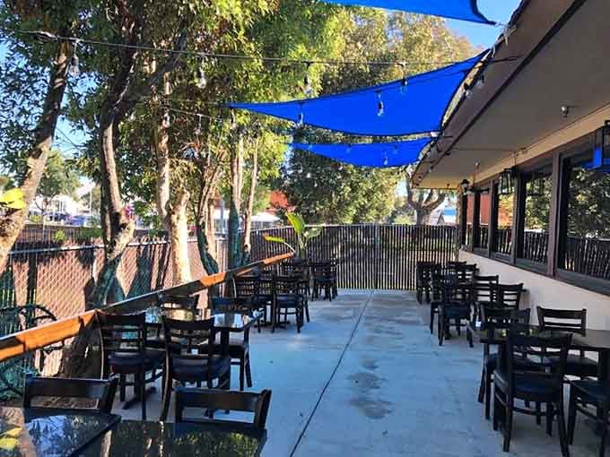 The shaded outdoor patio offers the perfect spot to enjoy your seafood boil under California's beautiful blue skies.