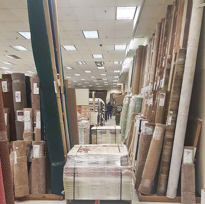 Carpets and rugs rolled up like scrolls of home improvement wisdom, waiting to cushion your floors.