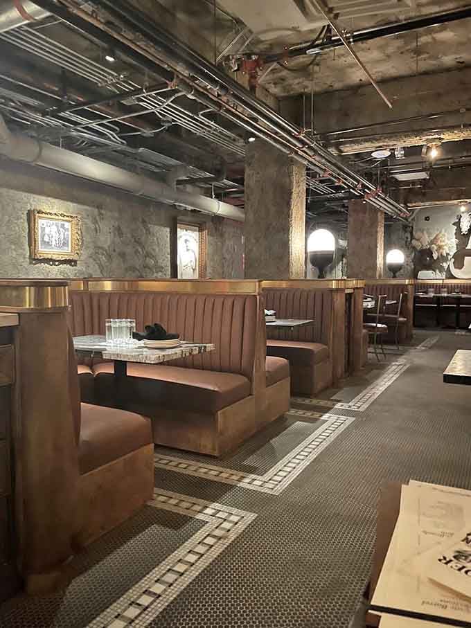 Leather booths and warm lighting transform this subterranean space into everyone's favorite hidden dining destination.