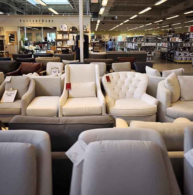 Furniture showroom filled with couches and chairs, because apparently outlet shopping extends beyond just updating your wardrobe now.