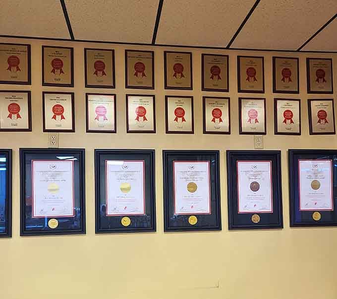 Walls lined with awards tell the story of excellence recognized, quality maintained, and standards never compromised over time.