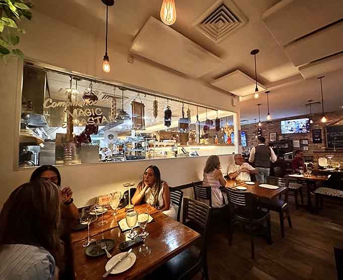 Happy diners enjoying their meals in a warm atmosphere that feels both special and wonderfully unpretentious simultaneously.