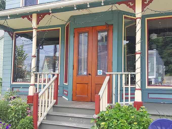 That welcoming porch with its colorful trim practically begs you to come inside and discover what delicious secrets await.