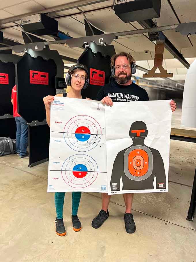 Happy shooters display their target results, proving Sharp Shooters delivers memorable experiences for all skill levels.
