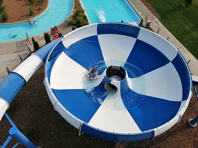 The swirling bowl slide spins riders like they're inside a giant blender set to "fun mode."