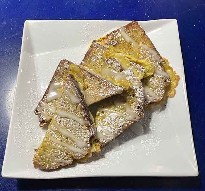 Lemon poppy French toast dusted with powdered sugar is what happens when breakfast gets fancy without trying too hard.