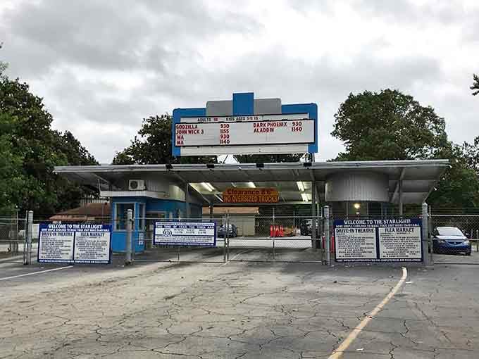 The classic marquee and entrance promise double features and affordable family fun in an era of expensive entertainment.