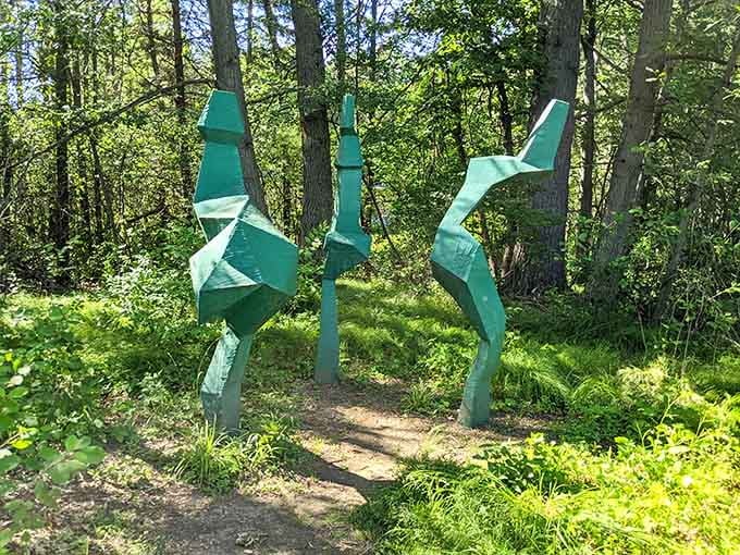 These towering sculptures stand like abstract sentinels, guarding the forest with angular grace and mysterious purpose.