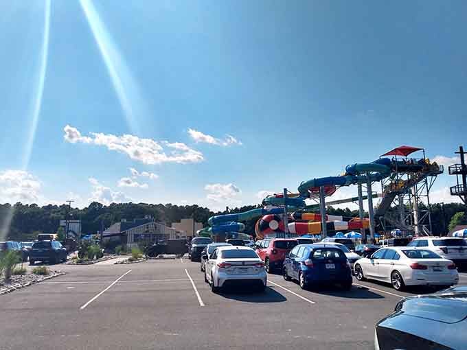 That parking lot view means one thing: adventure awaits just beyond those colorful tubes you see towering overhead.