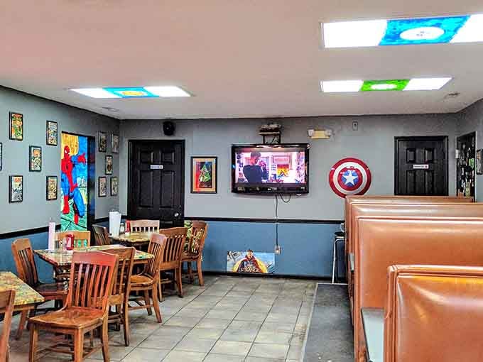 Orange booths and Captain America's shield on the wall set the perfect stage for your next meal adventure.