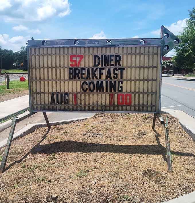 That roadside sign announces breakfast is coming, giving early birds something to dream about at night.