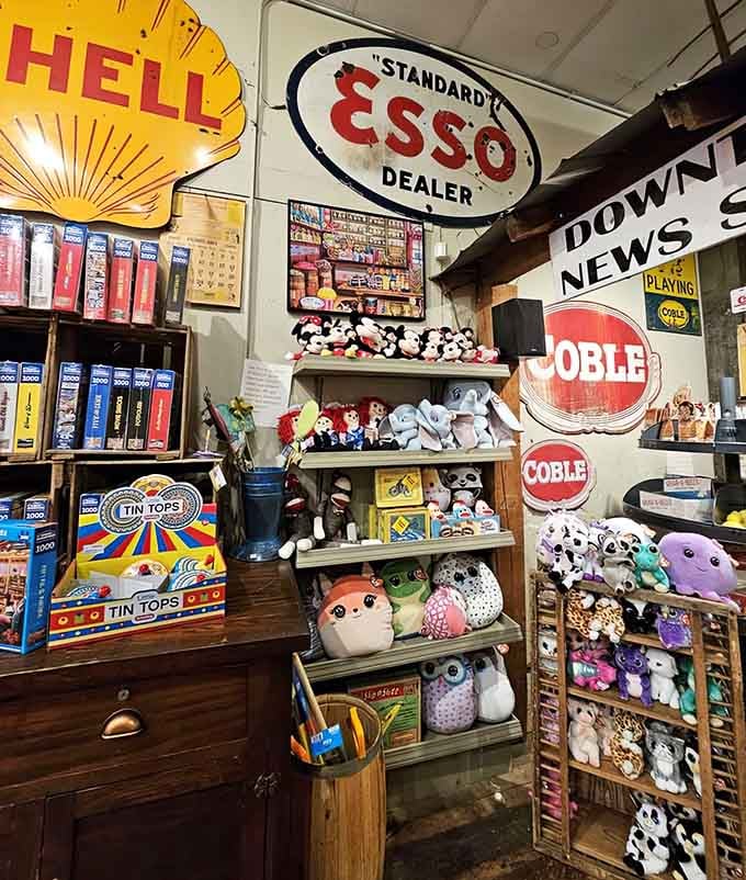 Vintage gas station signs share space with plush toys, creating a quirky museum where everything's actually for sale.