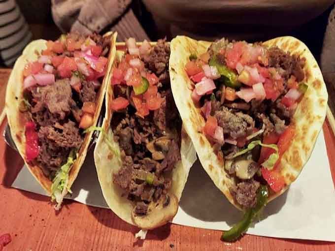 Tacos stuffed generously with seasoned meat and fresh toppings, proving that good food transcends any single cuisine or cultural boundary.
