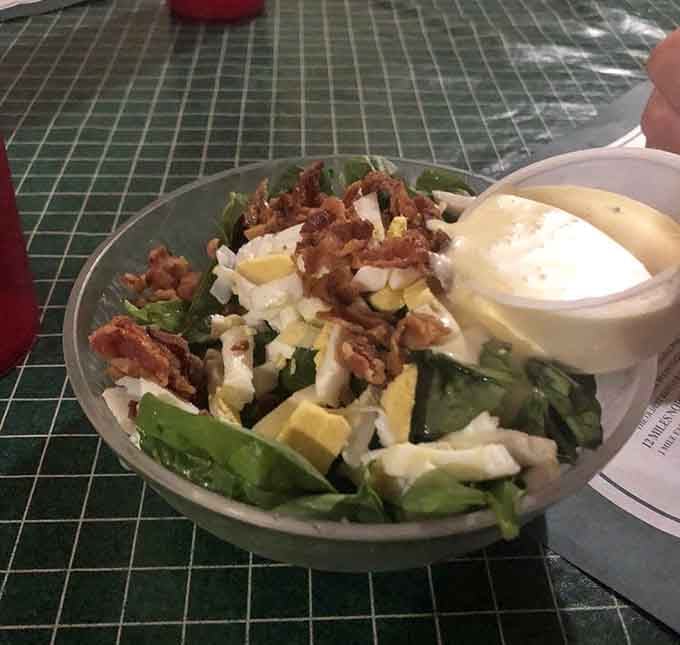 A proper salad with bacon, egg, and real ingredients—because even at a historic inn, vegetables deserve their moment.