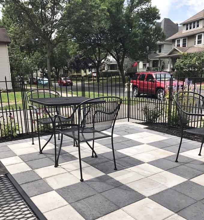 Checkerboard patio seating outside offers fresh air with your whimsy, weather permitting and highly recommended.