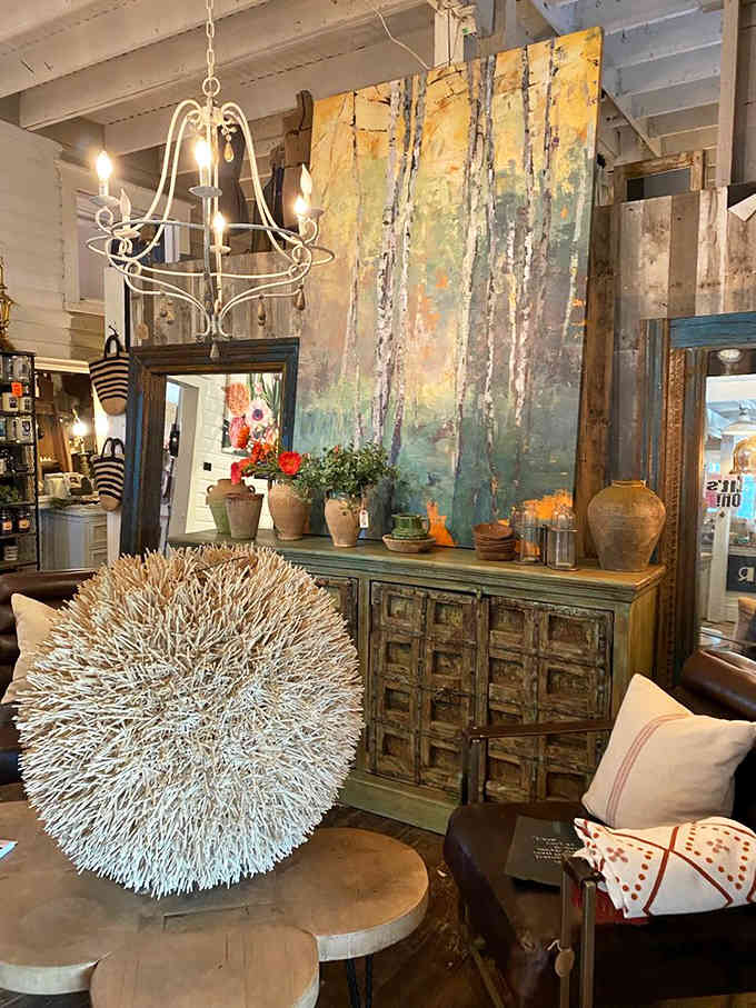 Distressed furniture and unique lighting creating vignettes that belong in magazines, not just antique stores.