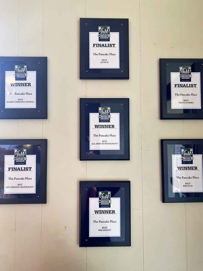 Awards covering the wall like breakfast battle scars, proof that locals know exactly what they're talking about here.