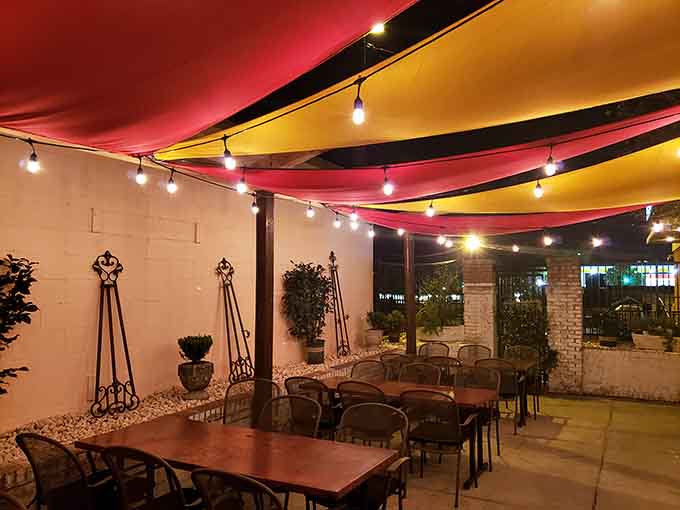 The patio offers al fresco dining under colorful canopies, perfect for those gorgeous North Carolina evenings.