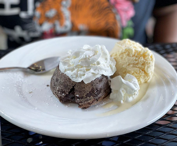 Chocolate lava cake with whipped cream proves dessert should never be considered optional here.