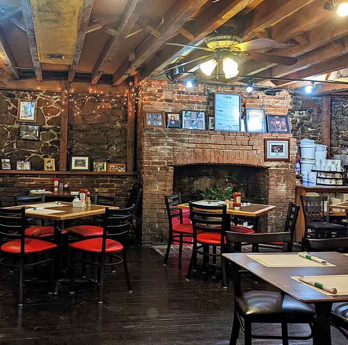 A brick fireplace anchors the space, adding rustic charm that makes you want to stay just a little longer.