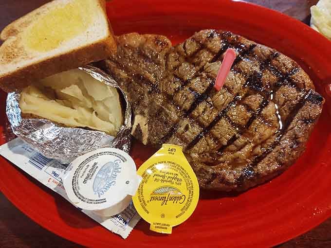 That massive ribeye with its perfect grill marks proves size does matter when it comes to Alabama steakhouse portions.