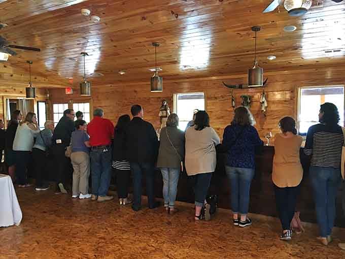 Inside the tasting room, eager guests gather around the bar like it's Christmas morning for grown-ups.
