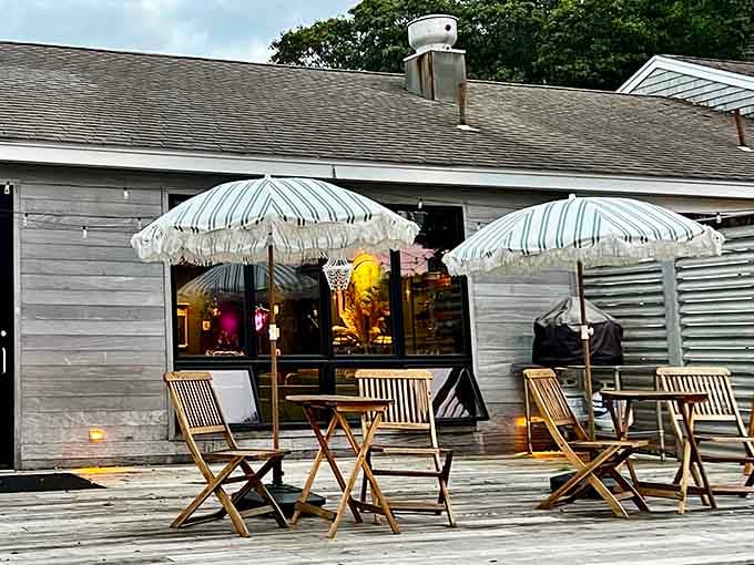 Outdoor seating with vintage umbrellas creates the perfect spot for leisurely meals and people watching in style.