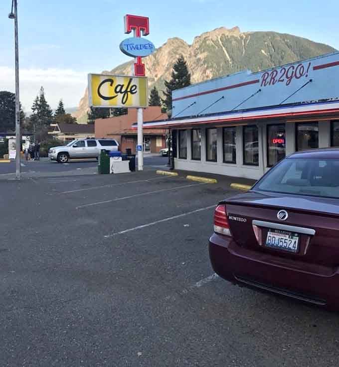 That iconic signage with Mount Si looming behind creates a photo opportunity you absolutely cannot pass up.