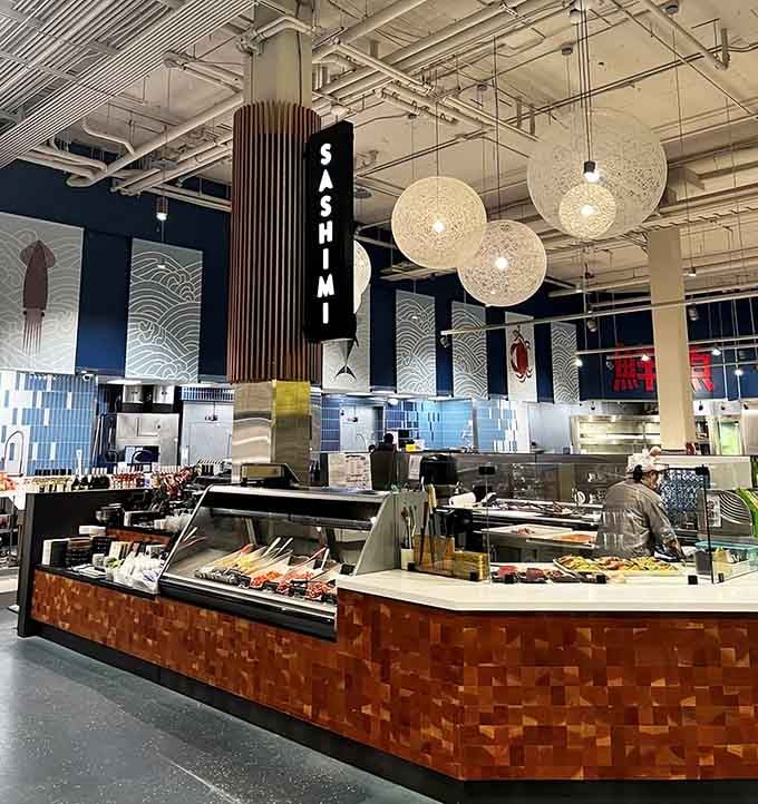 The sashimi station where skilled hands transform fresh fish into edible masterpieces right before your hungry eyes.