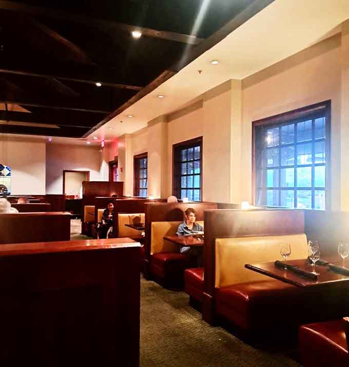 Booth seating that invites you to settle in, relax, and forget about the outside world completely.