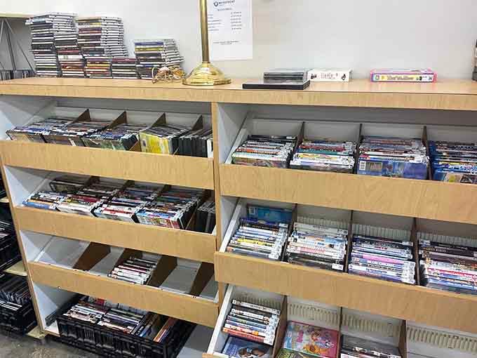 DVDs and CDs organized in drawers like a video store from the good old days, remember those times?
