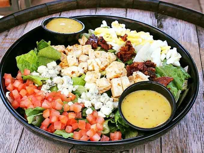 Fresh greens topped with grilled chicken, bacon, blue cheese, and hard-boiled eggs make salad feel less like punishment.