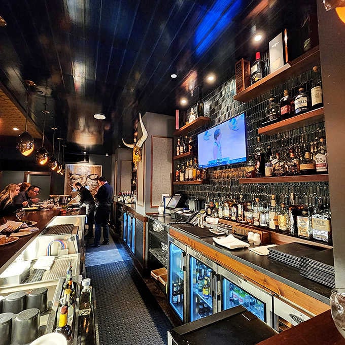 The well-stocked bar promises cocktails crafted with the same attention to detail as the kitchen's creations.