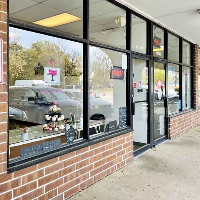 The storefront windows displaying treats like a gallery showcasing edible art for the Hampton community to discover.