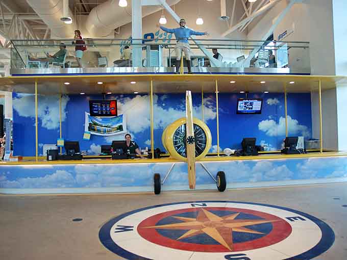 The admission counter features aviation-themed decor, setting the tone before you even get wet.