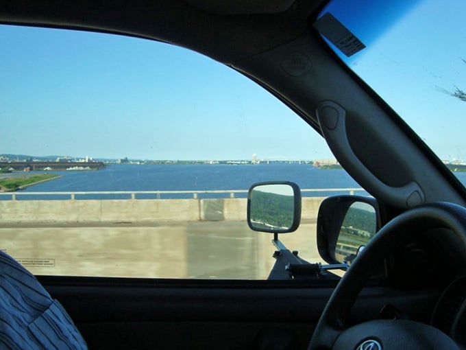 Behind the wheel, Lake Superior stretches endlessly ahead, making every mile feel like a personal discovery.