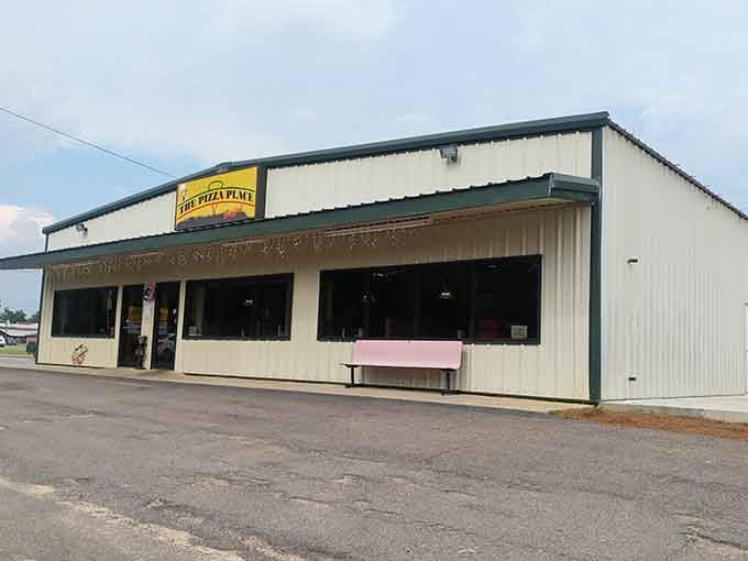 The Pizza Place sits unassuming and honest, the kind of spot where locals gather and tourists become instant regulars.