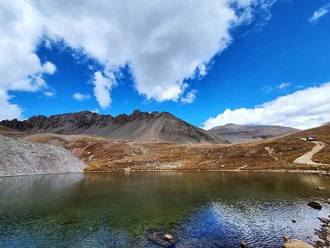 Wright Lake reflects surrounding peaks in mirror-perfect stillness, creating double the beauty for half the effort.