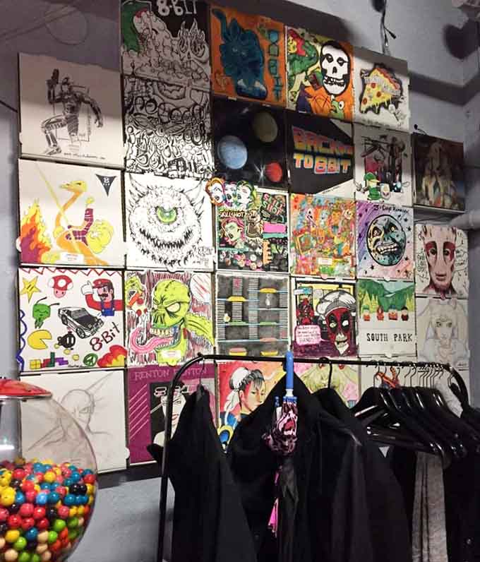 Pizza box art transforms walls into galleries, celebrating gaming culture with creativity that matches the playful spirit throughout.