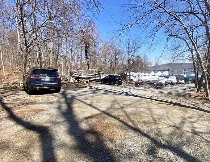 Early morning shadows stretch across the parking area, where eager hikers gather before venturing into the wilderness.