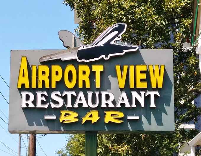 That vintage sign with the airplane silhouette tells you everything: great food with a side of aviation entertainment.