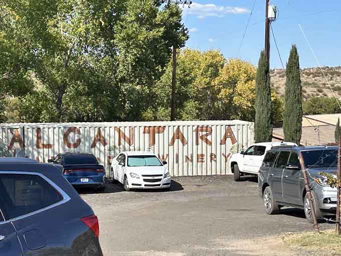 The rustic Alcantara parking sign is your first hint that something special awaits beyond those dusty Arizona roads.