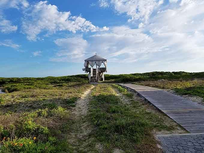 A solitary gazebo overlooking dunes, perfect for those moments when you need to contemplate absolutely nothing at all.