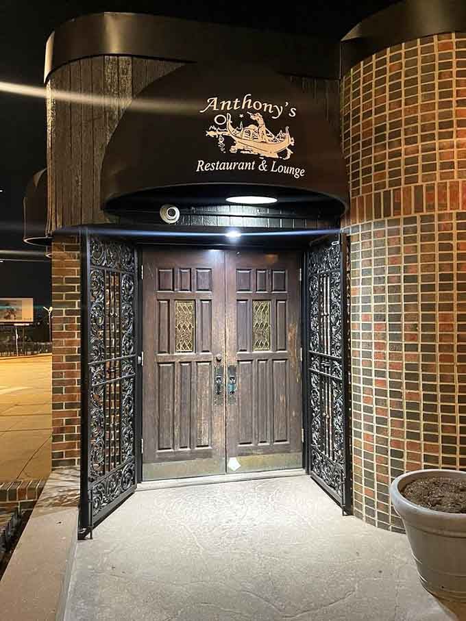 Those ornate entrance doors frame the promise of authentic Italian cooking waiting just beyond the threshold.