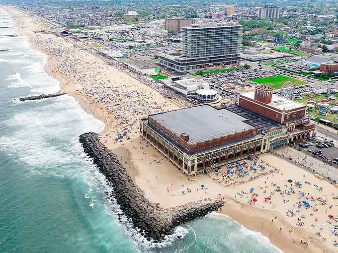 From above, Convention Hall anchors the beach like a grand dame hosting the ocean's endless summer party with style.