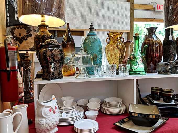 Delicate glassware and vintage dishes displayed carefully, offering elegant table settings at prices that encourage actually using them daily.