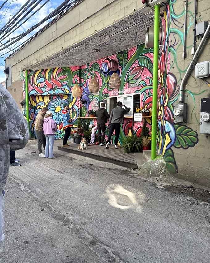 Following the mural-covered path to fried dough enlightenment, where the journey is almost as sweet as the destination.